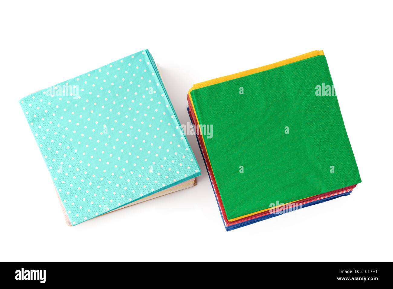Two stacks of colorful paper napkins on white background Stock Photo ...