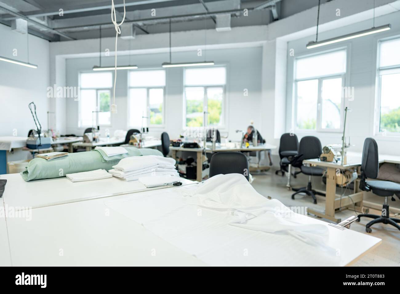 Interior of a sewing warehouse of furniture factory with equipment and ...