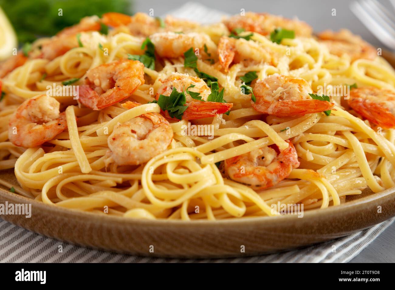 Baked Shrimp Scampi Linguine Pasta with Parsley on a Plate, side view ...