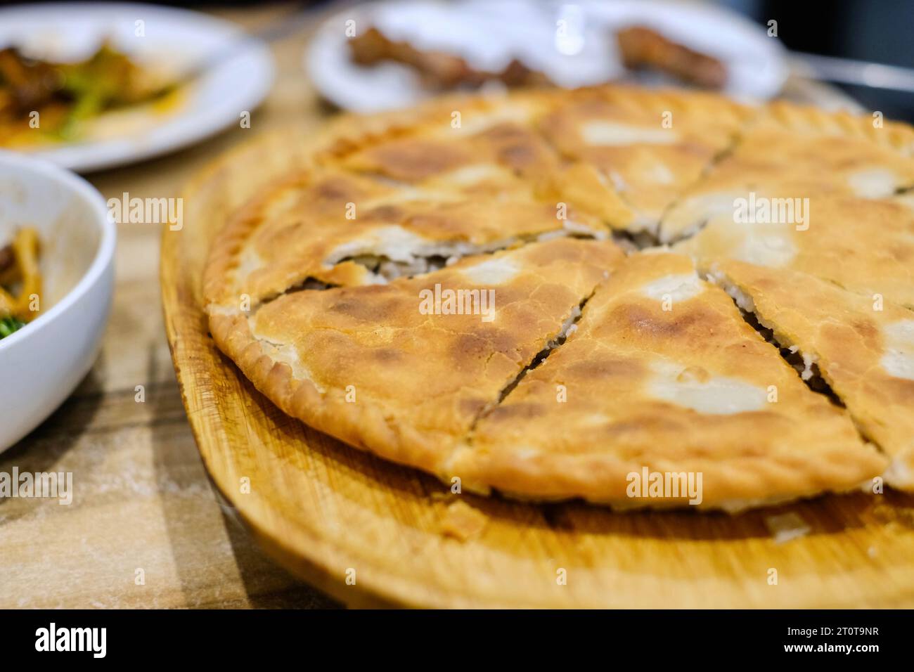 Goshnan, or gosh-naan, a traditional Uyghur pie stuffed with spiced ...