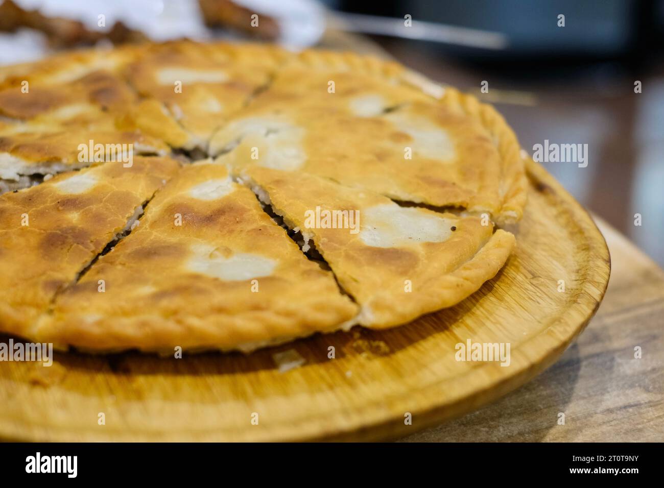 Goshnan, or gosh-naan, a traditional Uyghur pie stuffed with spiced ...