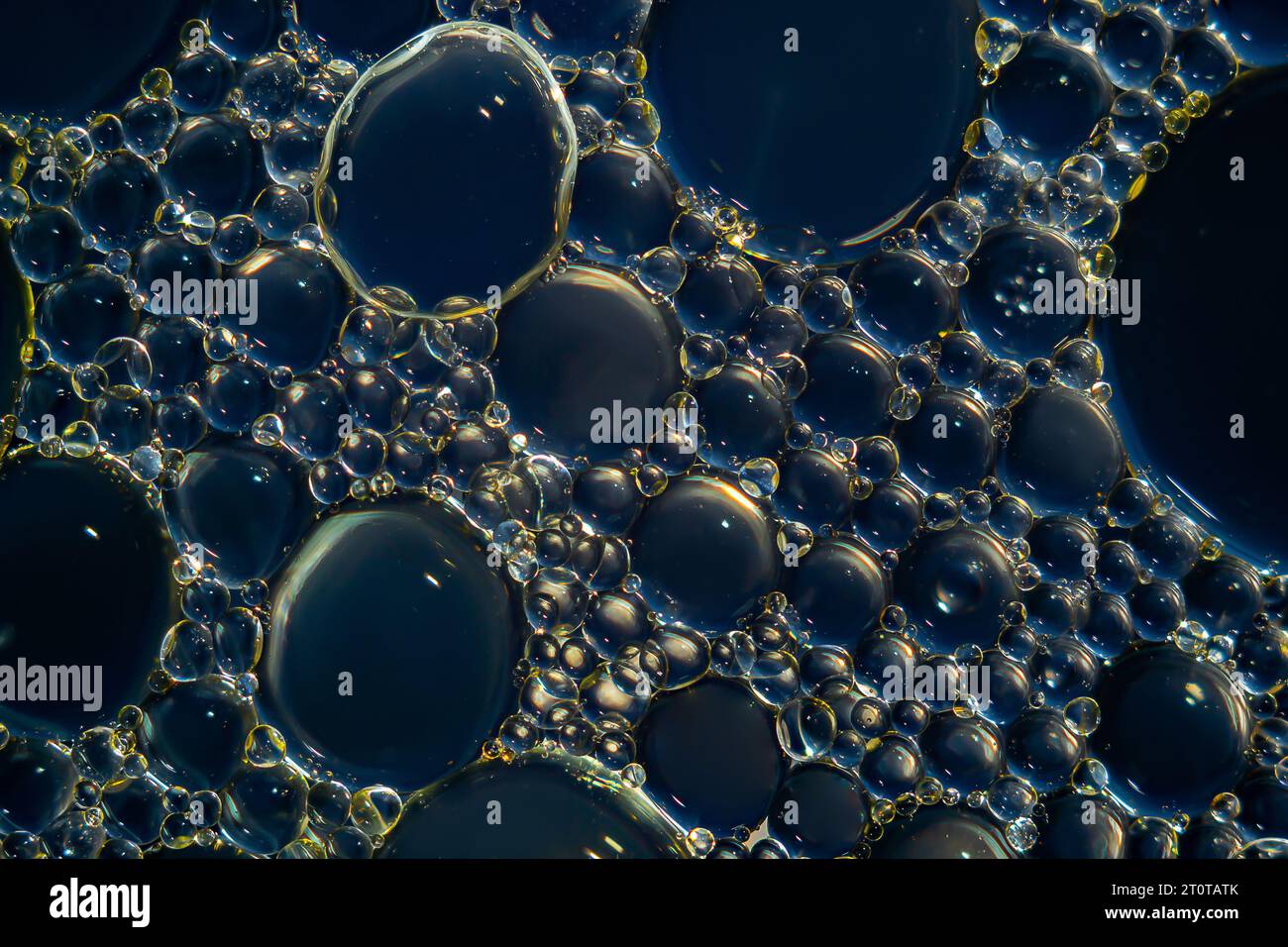 Macrophoto of oil droplets and bubbles on a water surface Stock Photo ...
