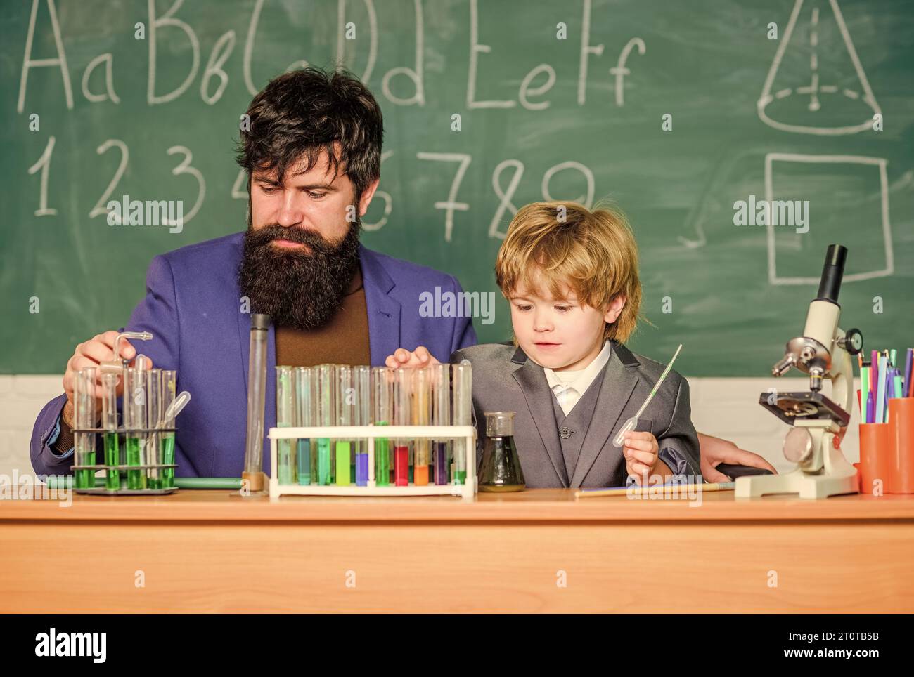 Cognitive process. Back to school. Chemistry experiment. Teacher child ...