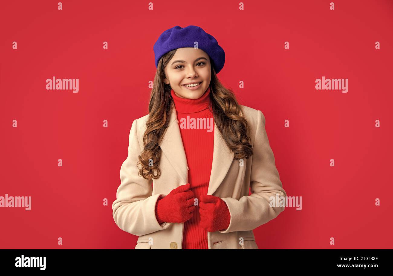 smiling french teen girl isolated on red background. french french teen ...