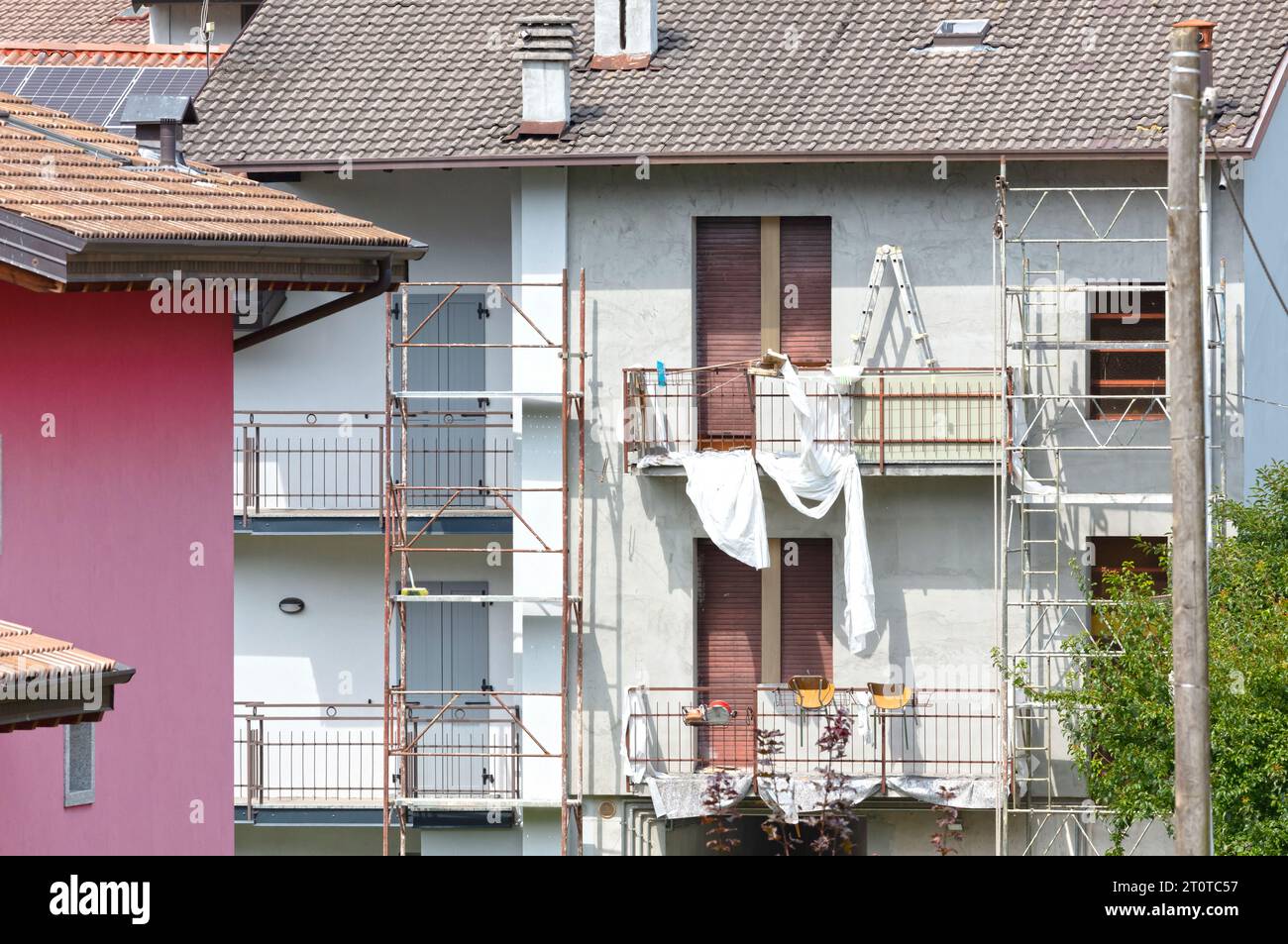 Work in progress, scaffolding next to a house Stock Photo - Alamy