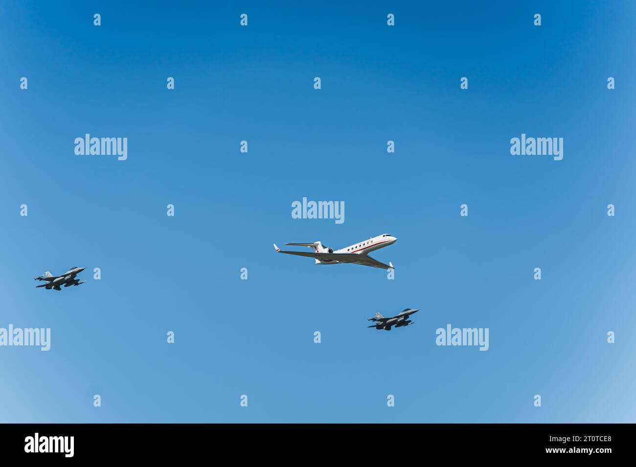 Open-air military parade in Poland. Presidential plane flying through ...