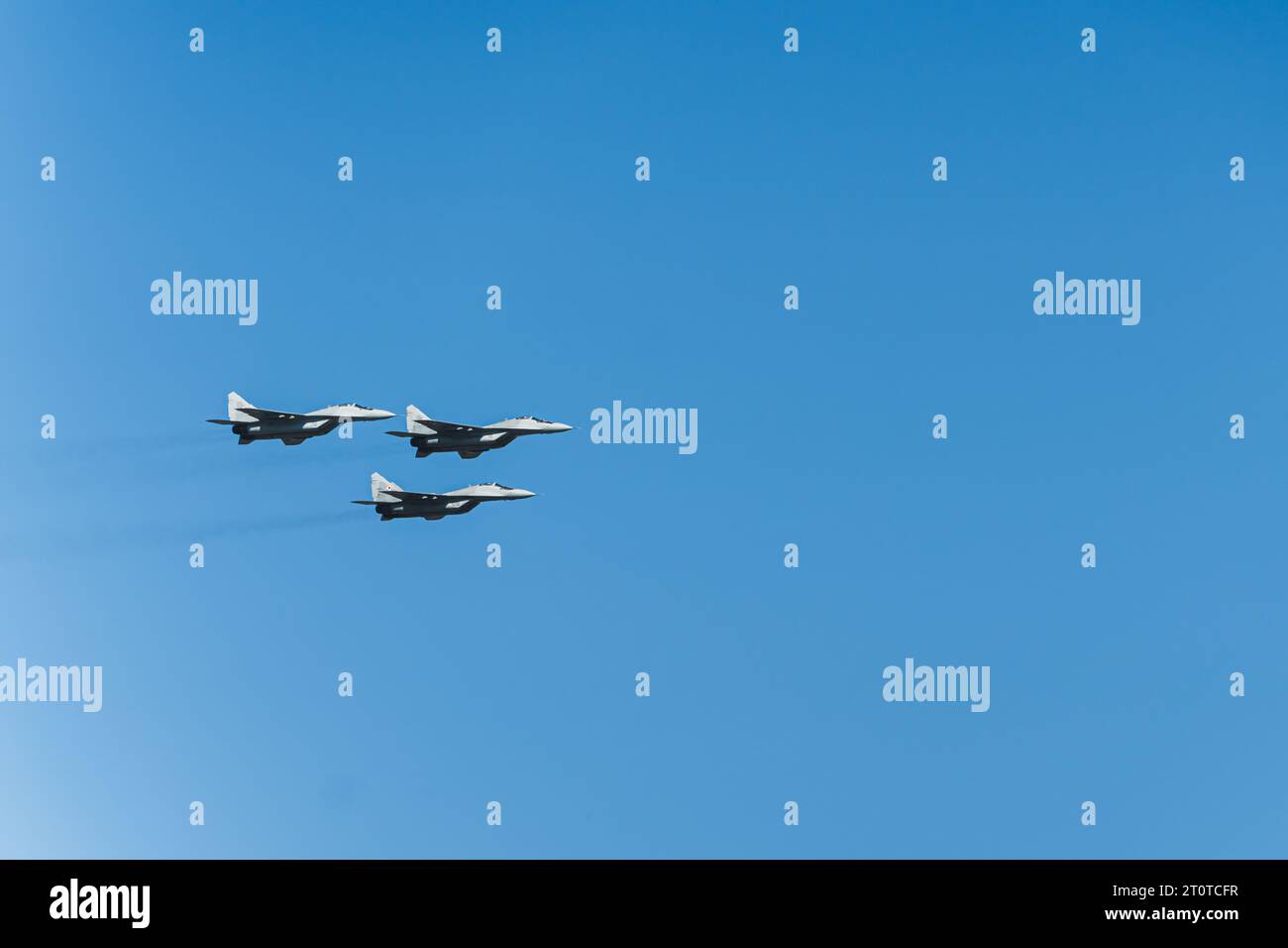 Three military F16 fighter jets flying through the air during military ...