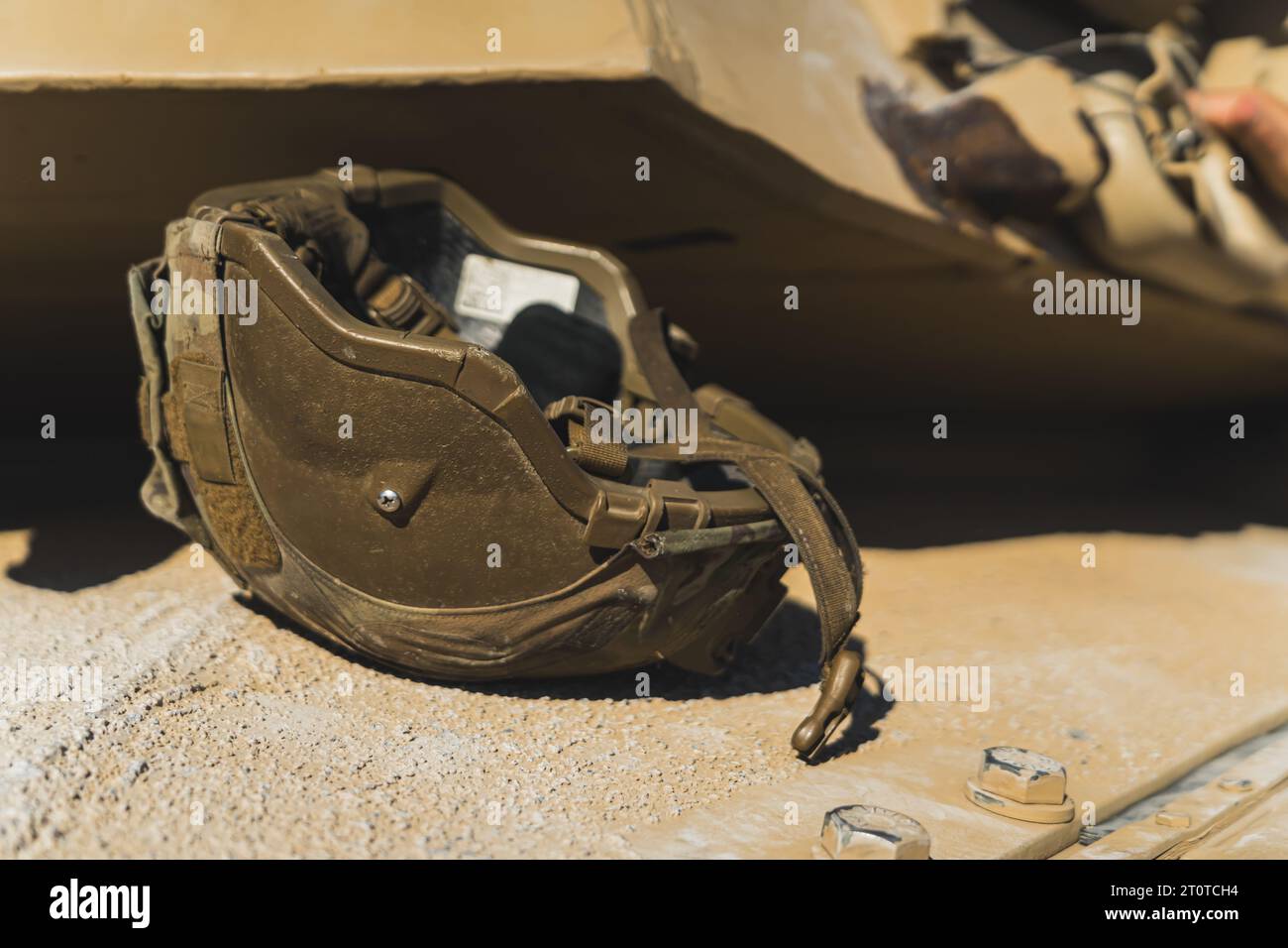 A military helmet lies on the ground. Modern equipment used in military ...