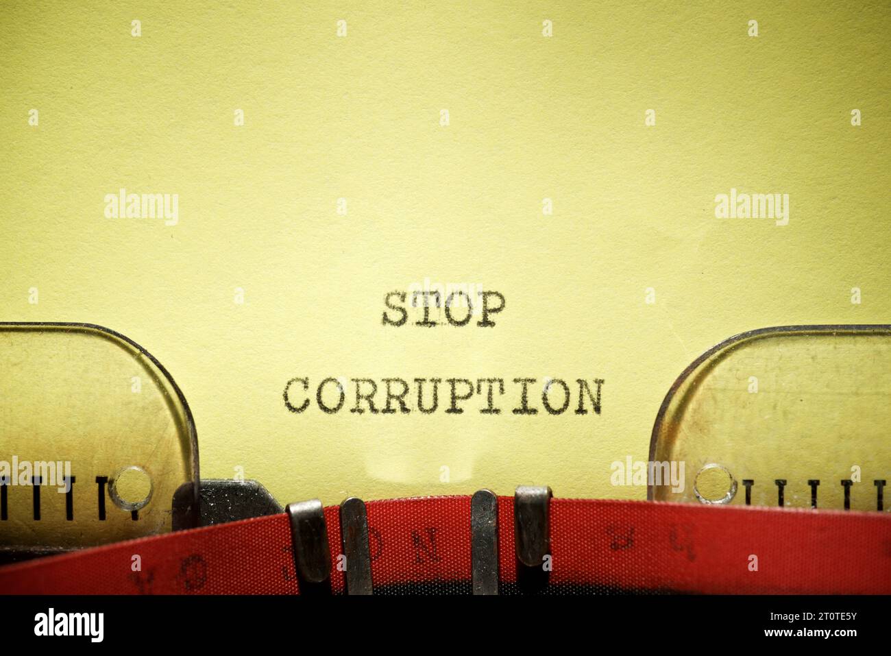 Stop corruption text written with a typewriter Stock Photo - Alamy