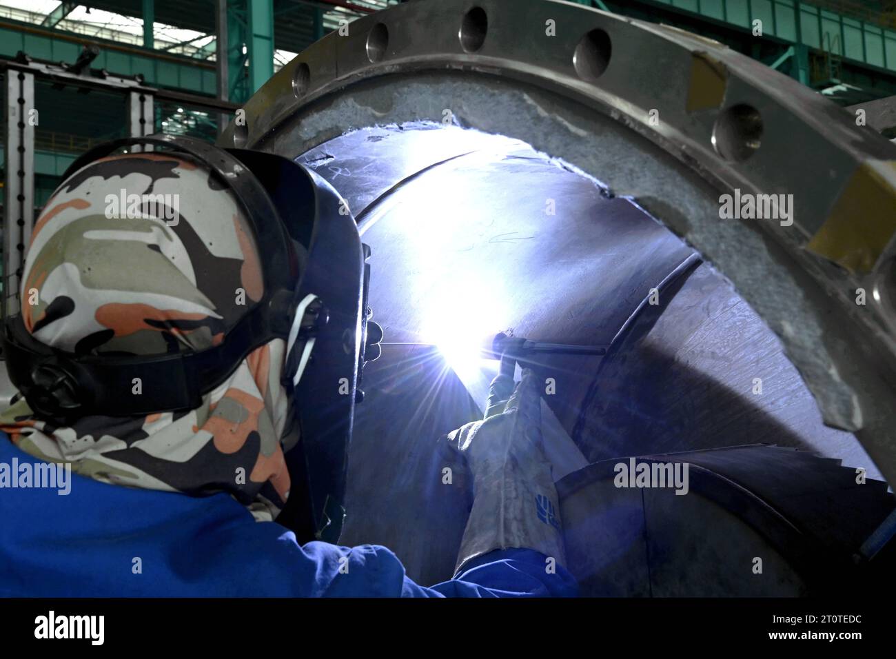 JINGJIANG, CHINA - OCTOBER 9, 2023 - Workers weld steel products at an ...