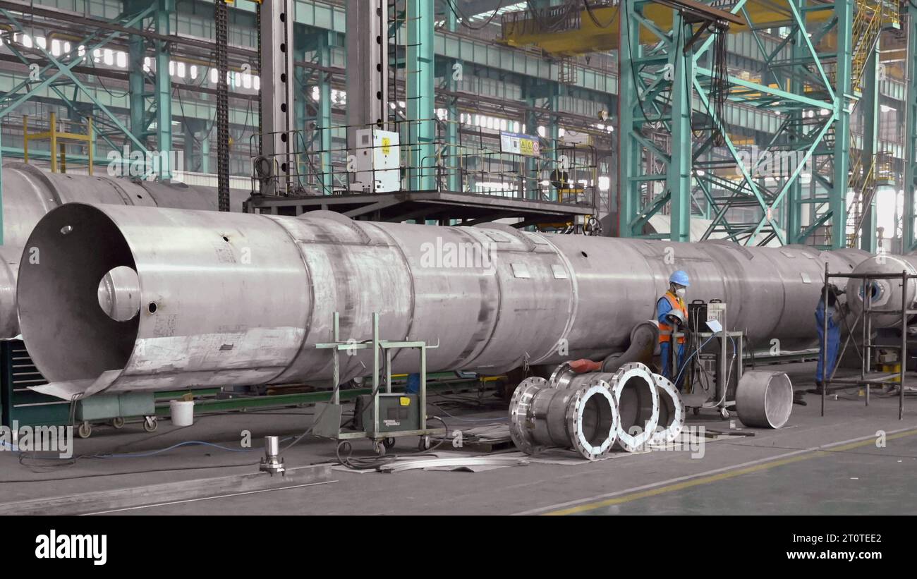 JINGJIANG, CHINA - OCTOBER 9, 2023 - Workers weld steel products at an ...
