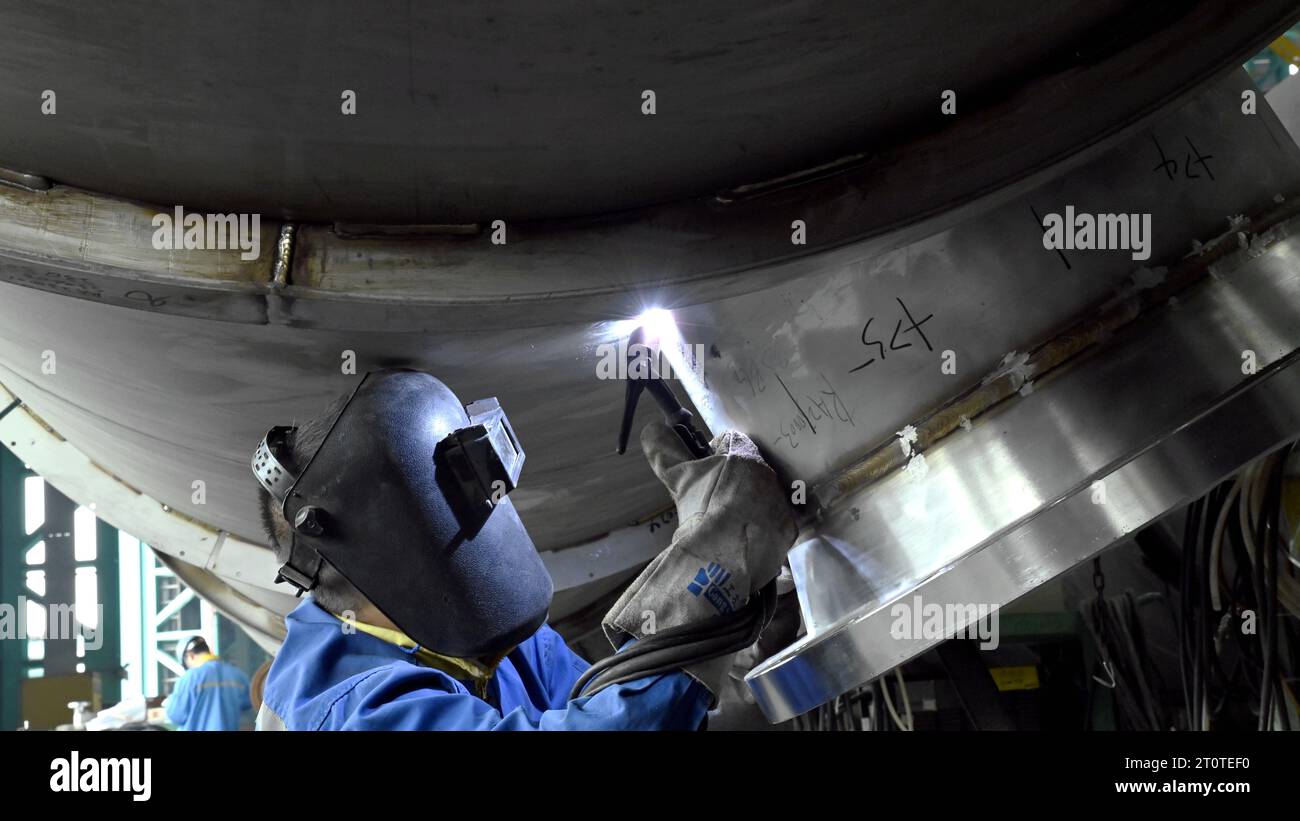 JINGJIANG, CHINA - OCTOBER 9, 2023 - Workers weld steel products at an ...