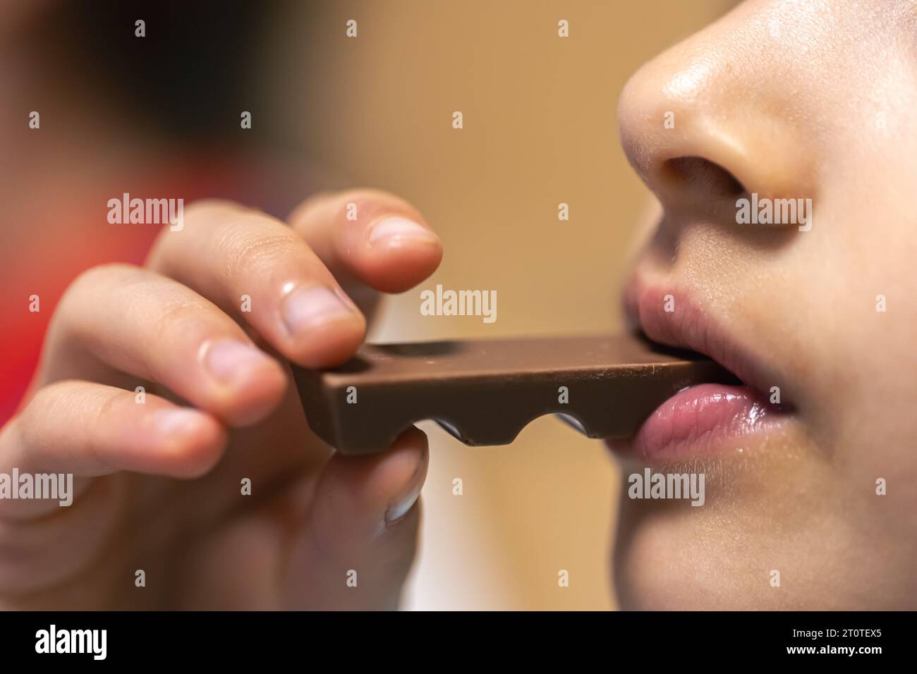 Child girl eating chocolate flavor hi-res stock photography and images ...