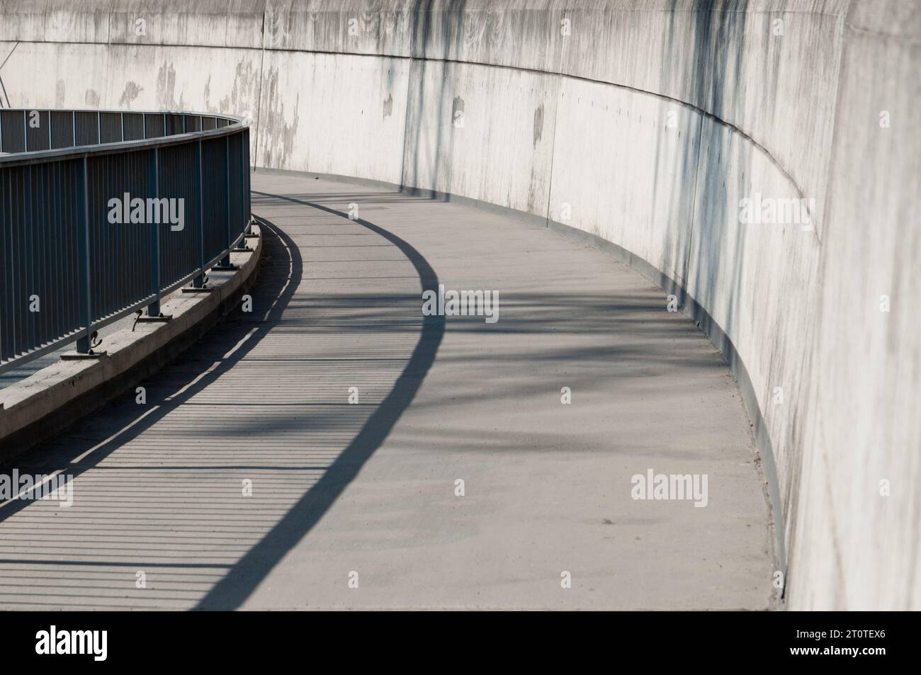 A view of an urban sidewalk at a street underpass Stock Photo - Alamy