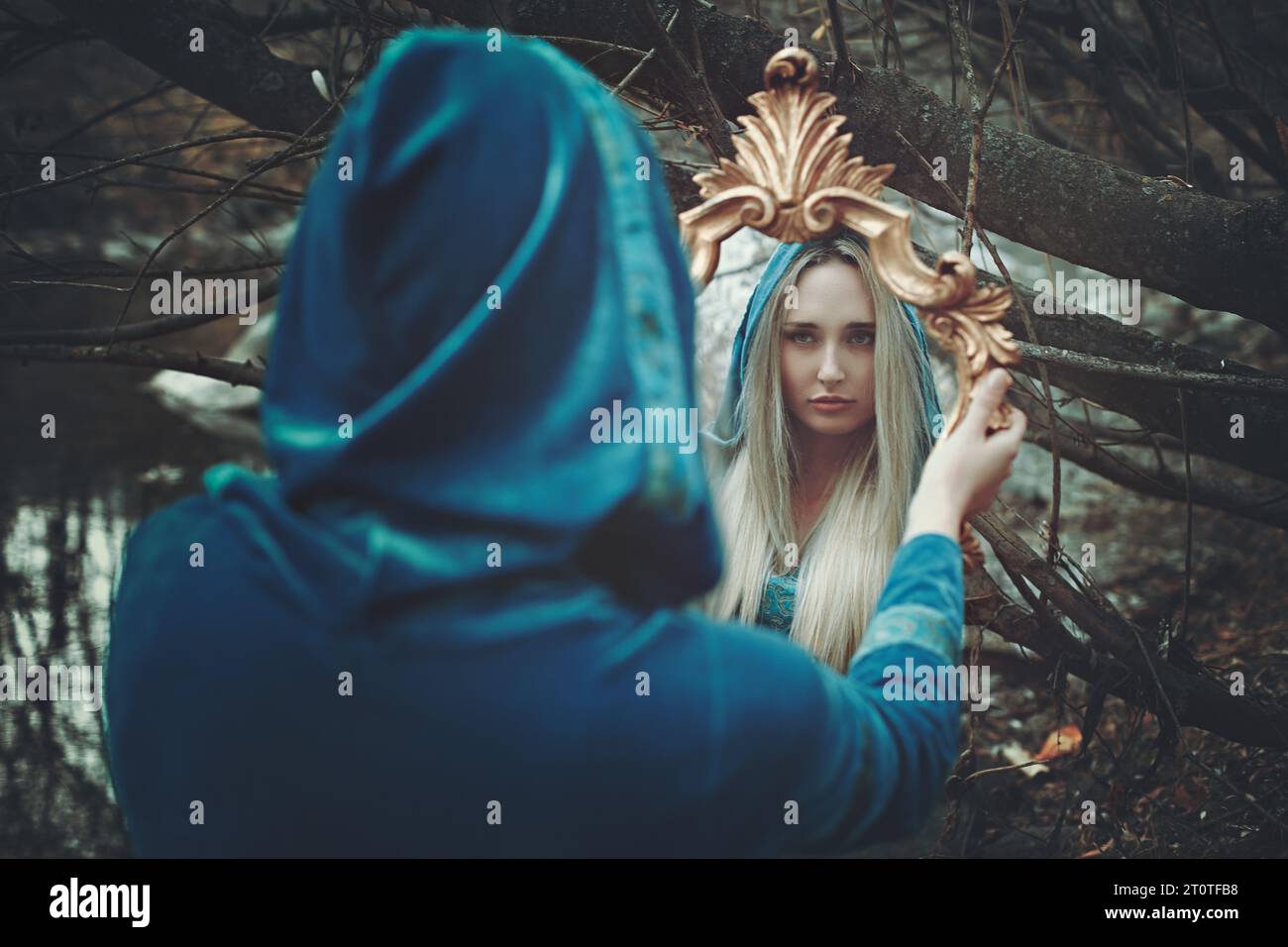 Beautiful maiden reflected in a mirror Stock Photo - Alamy
