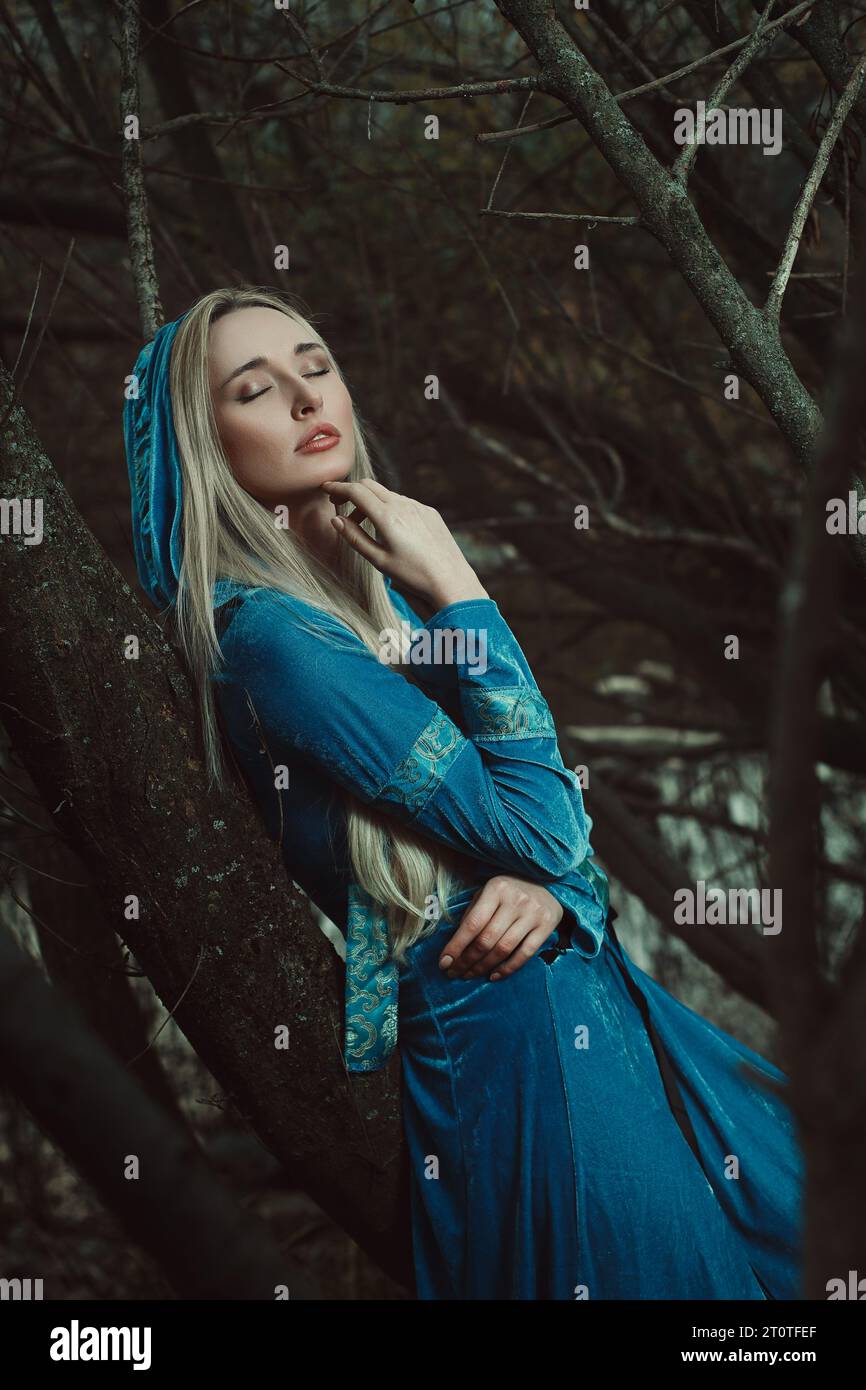 Elfin woman in winter woods Stock Photo - Alamy