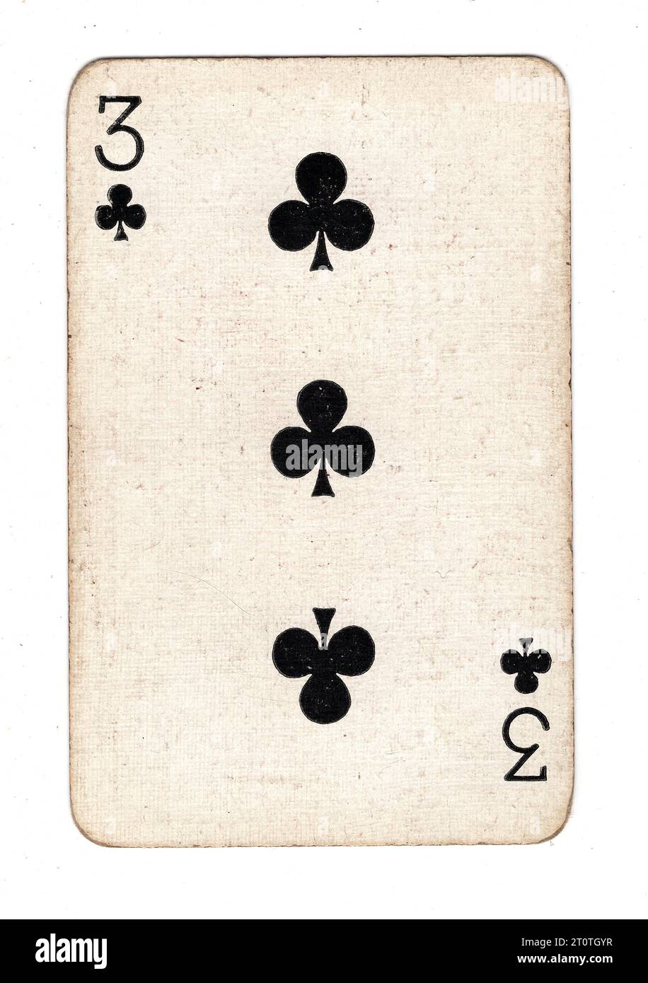 A vintage three of clubs playing card isolated on a white background ...