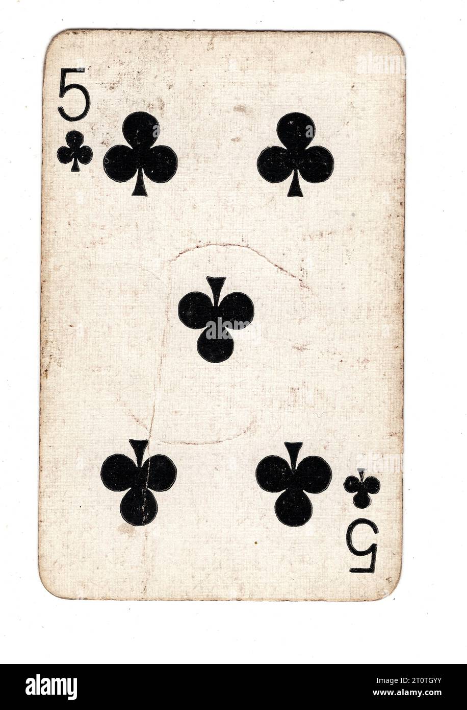 A vintage five of clubs playing card isolated on a white background ...
