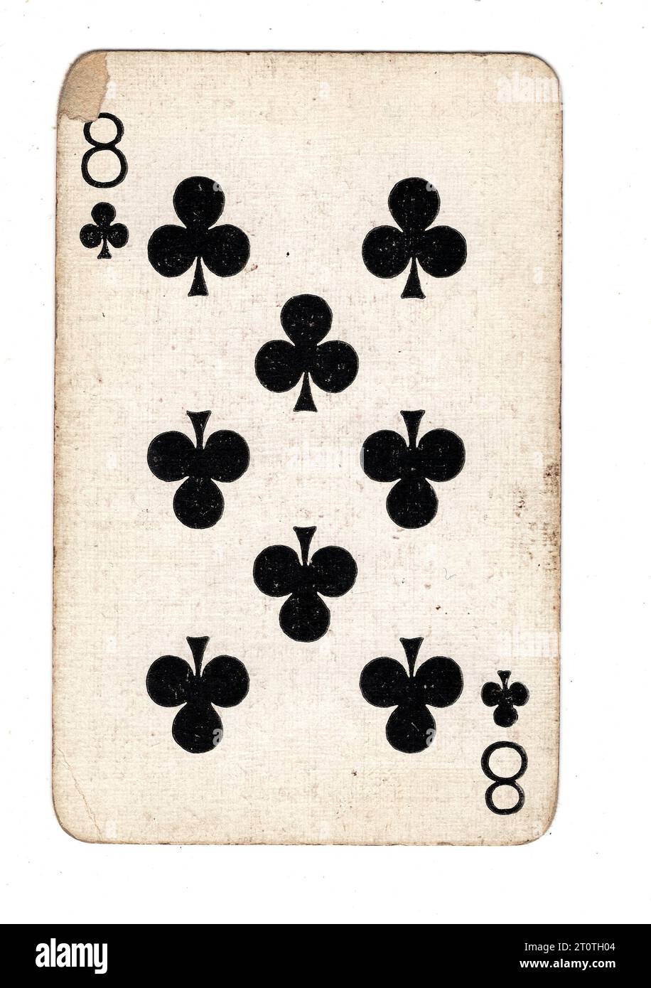 A vintage eight of clubs playing card isolated on a white background ...