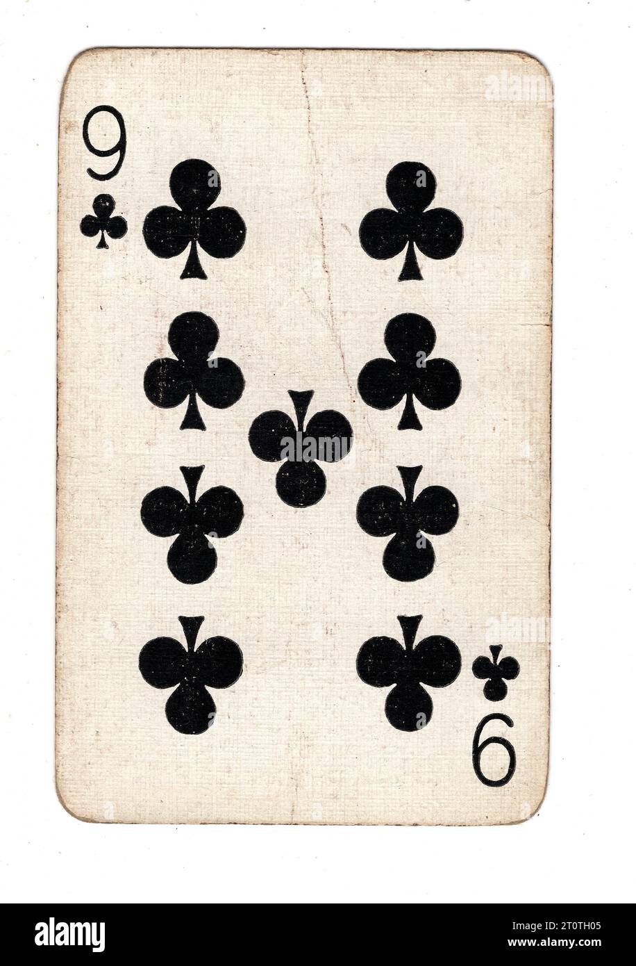 A vintage nine of clubs playing card isolated on a white background ...