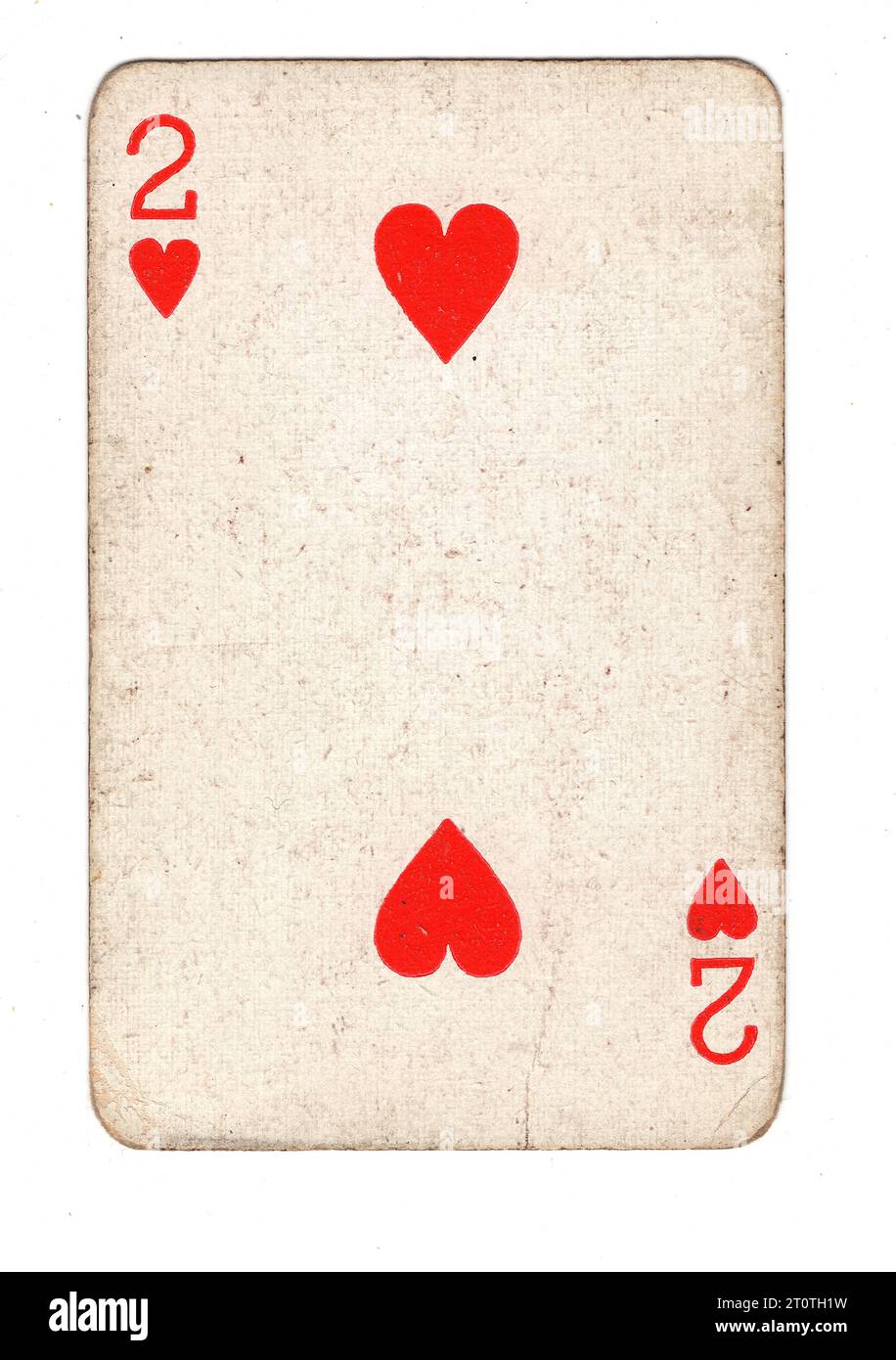 A vintage two of hearts playing card isolated on a white background ...