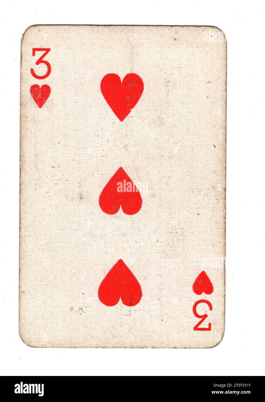 A vintage three of hearts playing card isolated on a white background ...