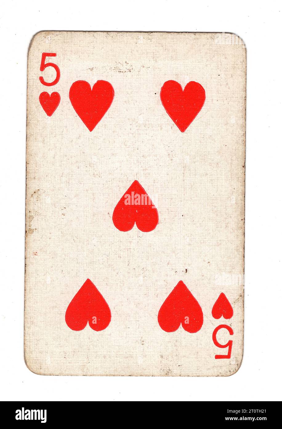 A vintage five of hearts playing card isolated on a white background ...