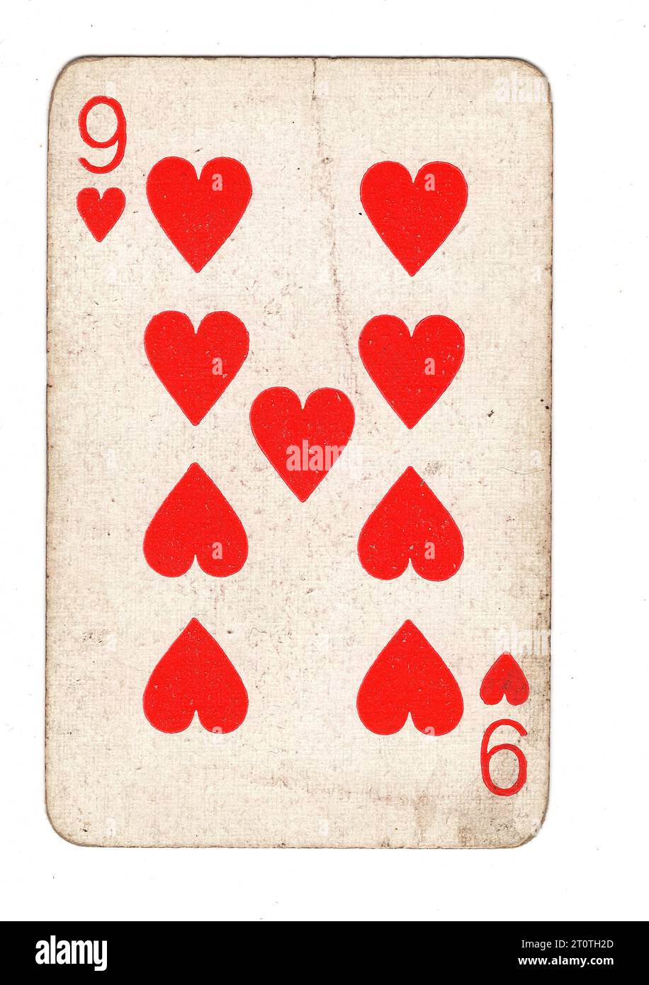 A vintage nine of hearts playing card isolated on a white background ...