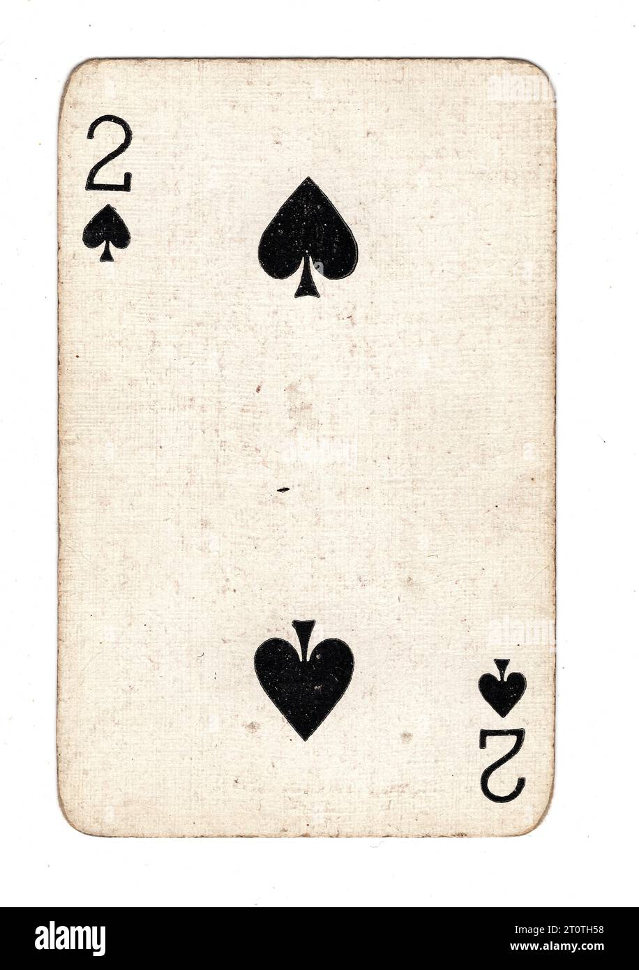 A vintage two of spades playing card isolated on a white background ...