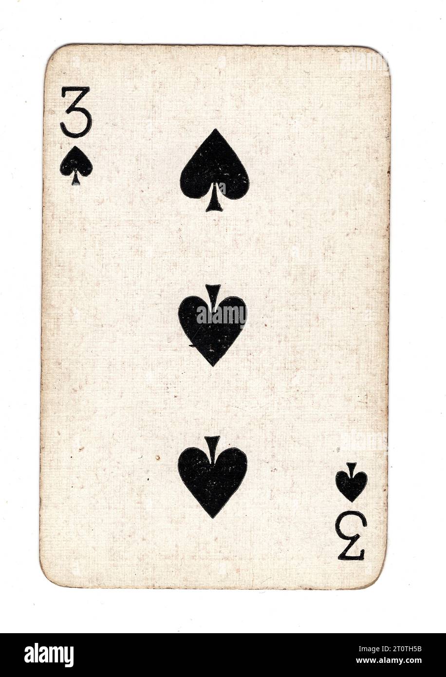 A vintage three of spades playing card isolated on a white background ...