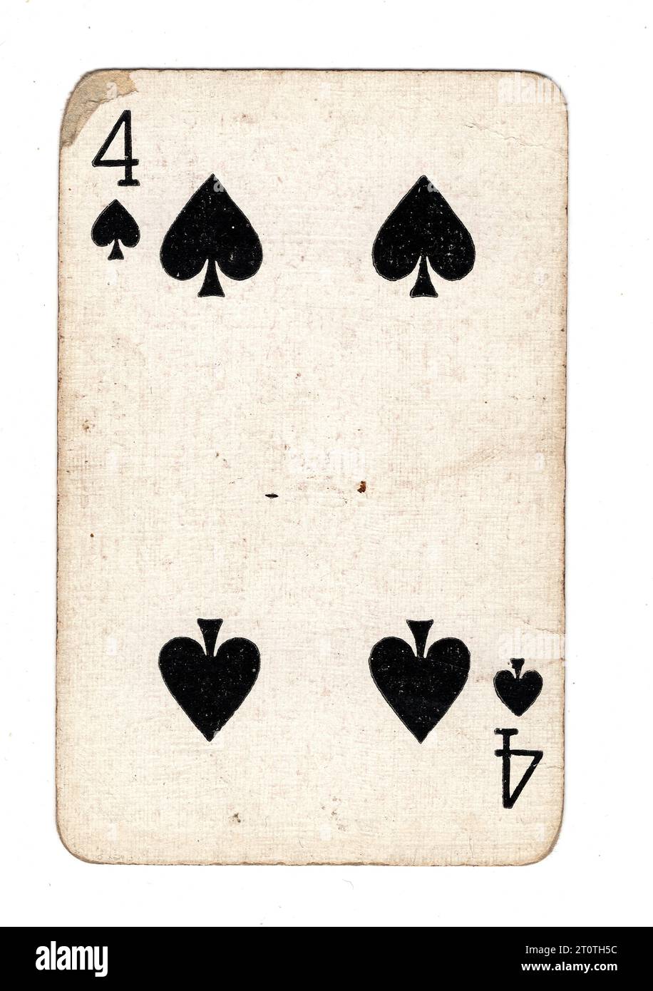 A vintage four of spades playing card isolated on a white background ...