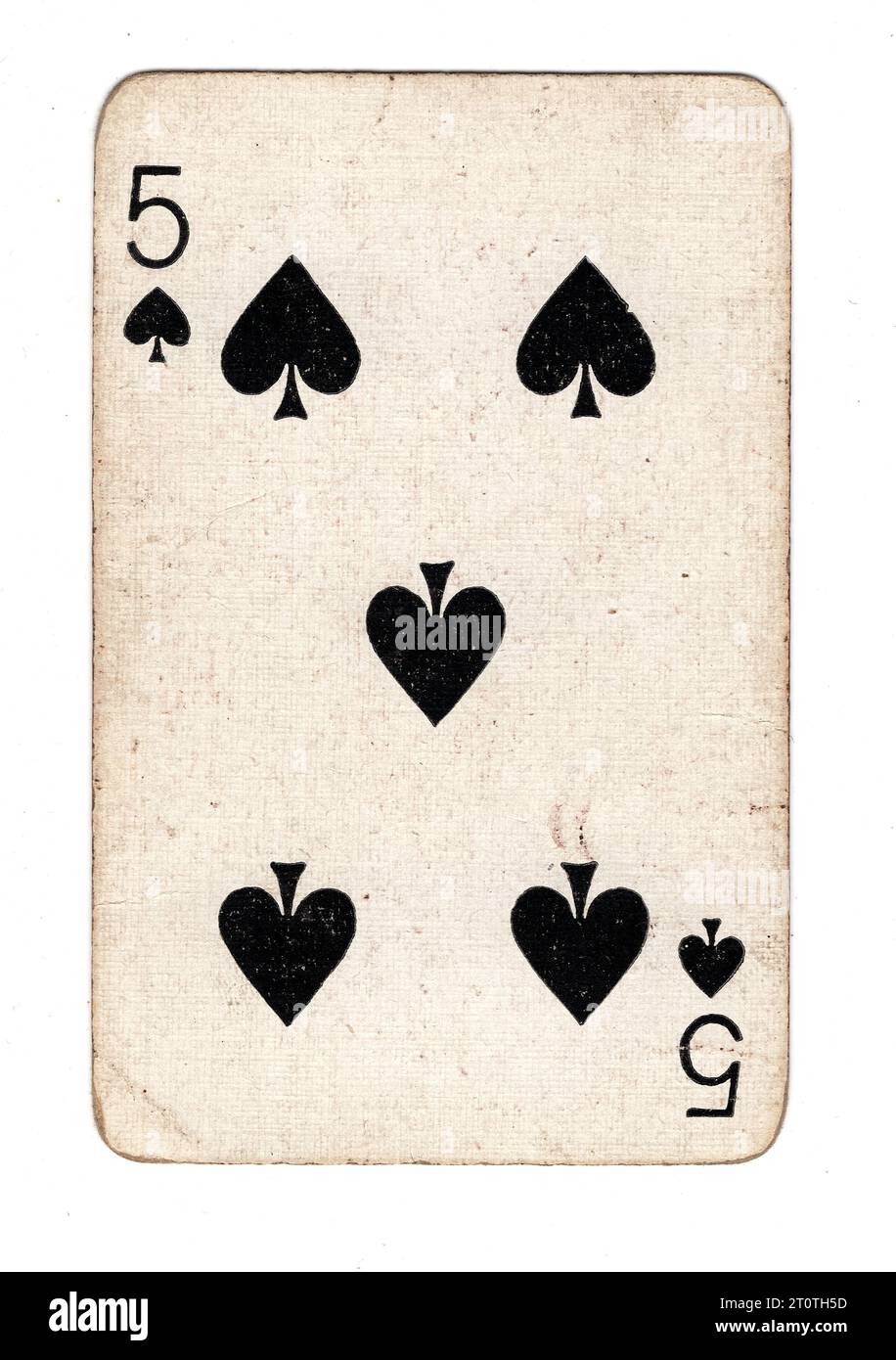 A vintage five of spades playing card isolated on a white background ...