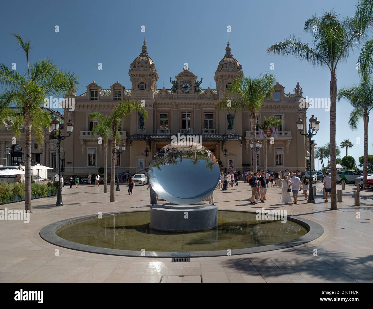 A stunning outdoor scene featuring a circular fountain with majestic ...