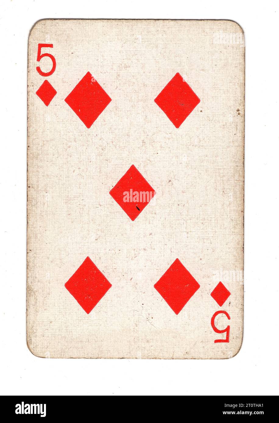 A vintage five of diamonds playing card isolated on a white background ...