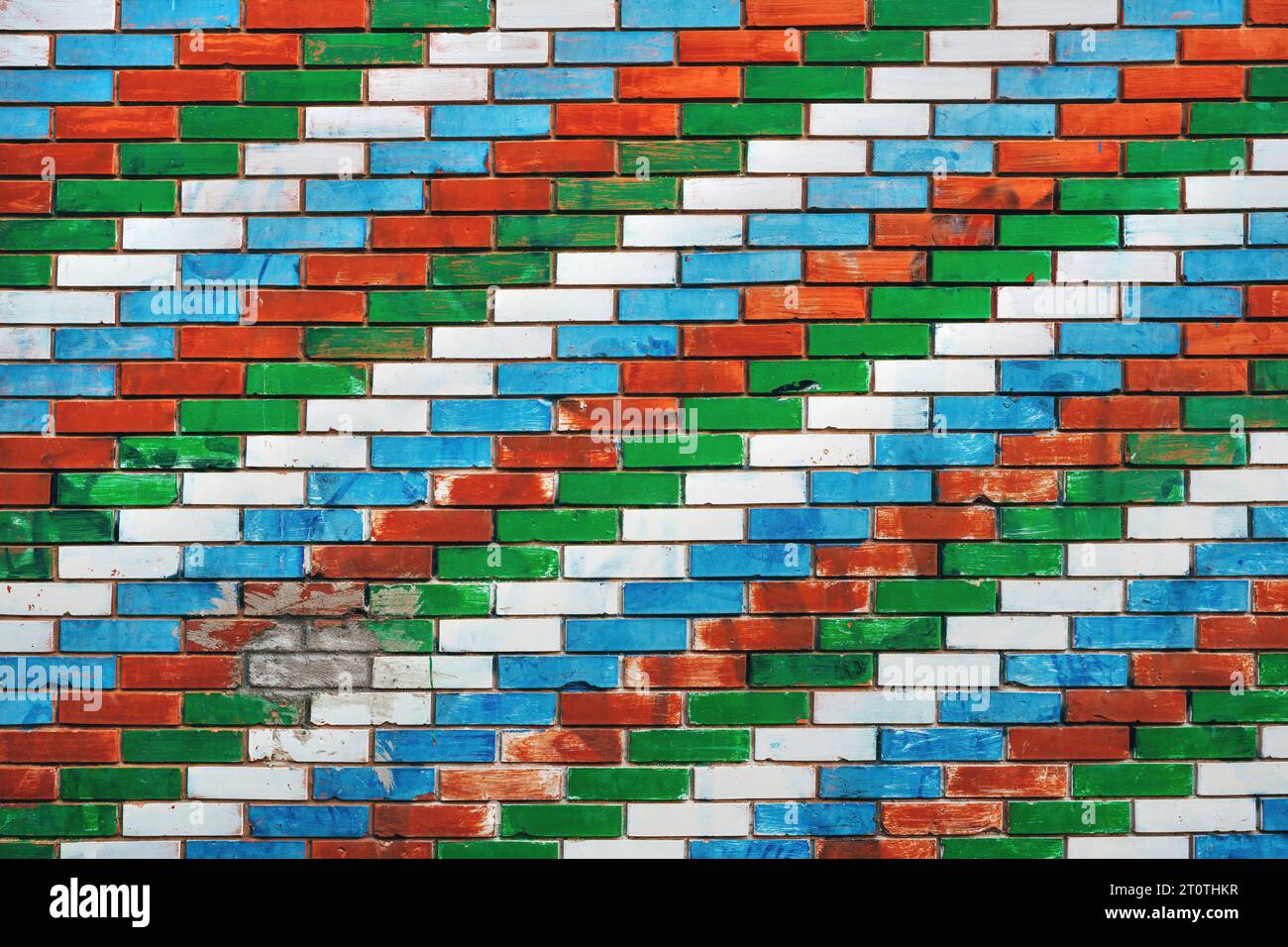 Colorful brick wall with diagonal pattern with white, blue, red and ...