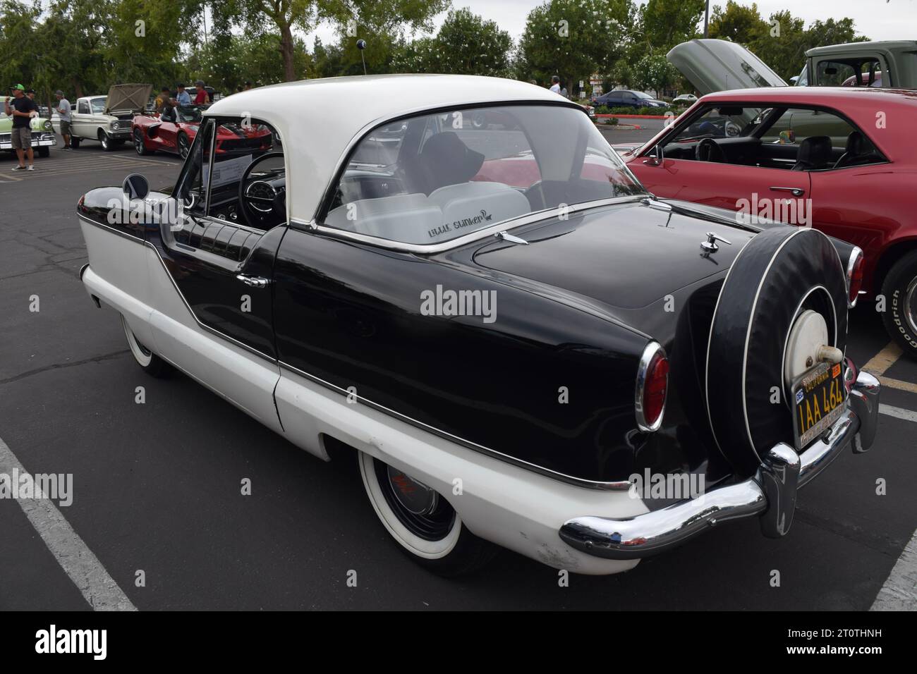 A side back end view of photo of a cute Classic 1957 NASH car in black ...