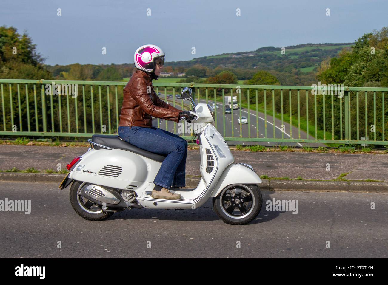 2018 Woman riding White Italian Piaggio Vespa GTS 300 Super ABS Scooter ...