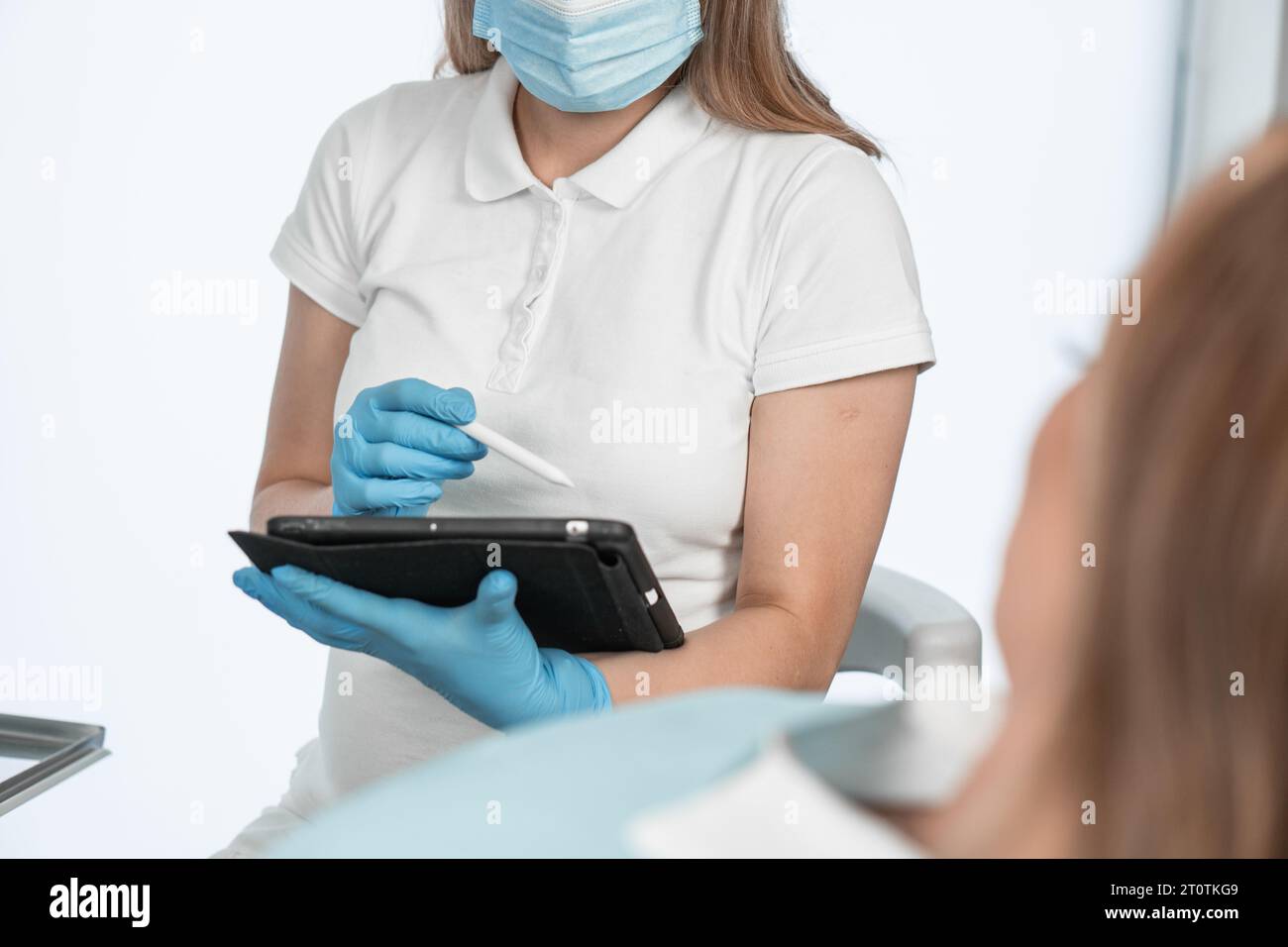 Patient consults doctor assistant hi-res stock photography and images ...