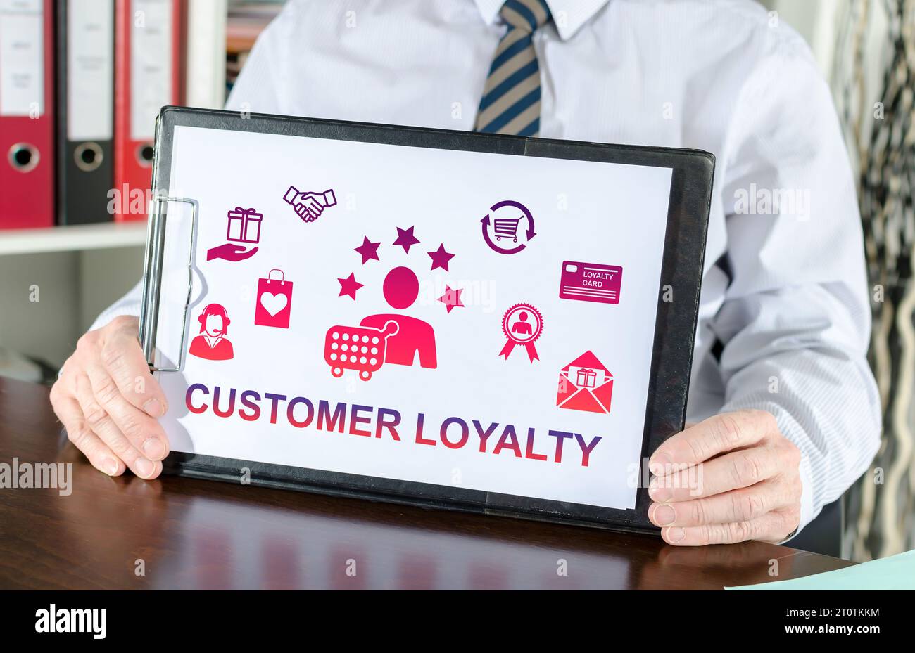 Customer loyalty concept shown by a businessman Stock Photo - Alamy