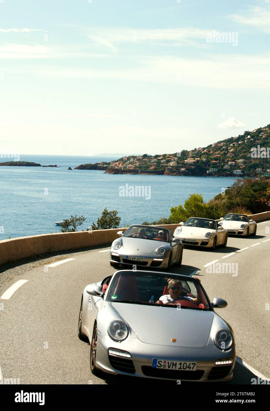 Porche cars driving along the Esterel coast road, Var, Provence, France ...