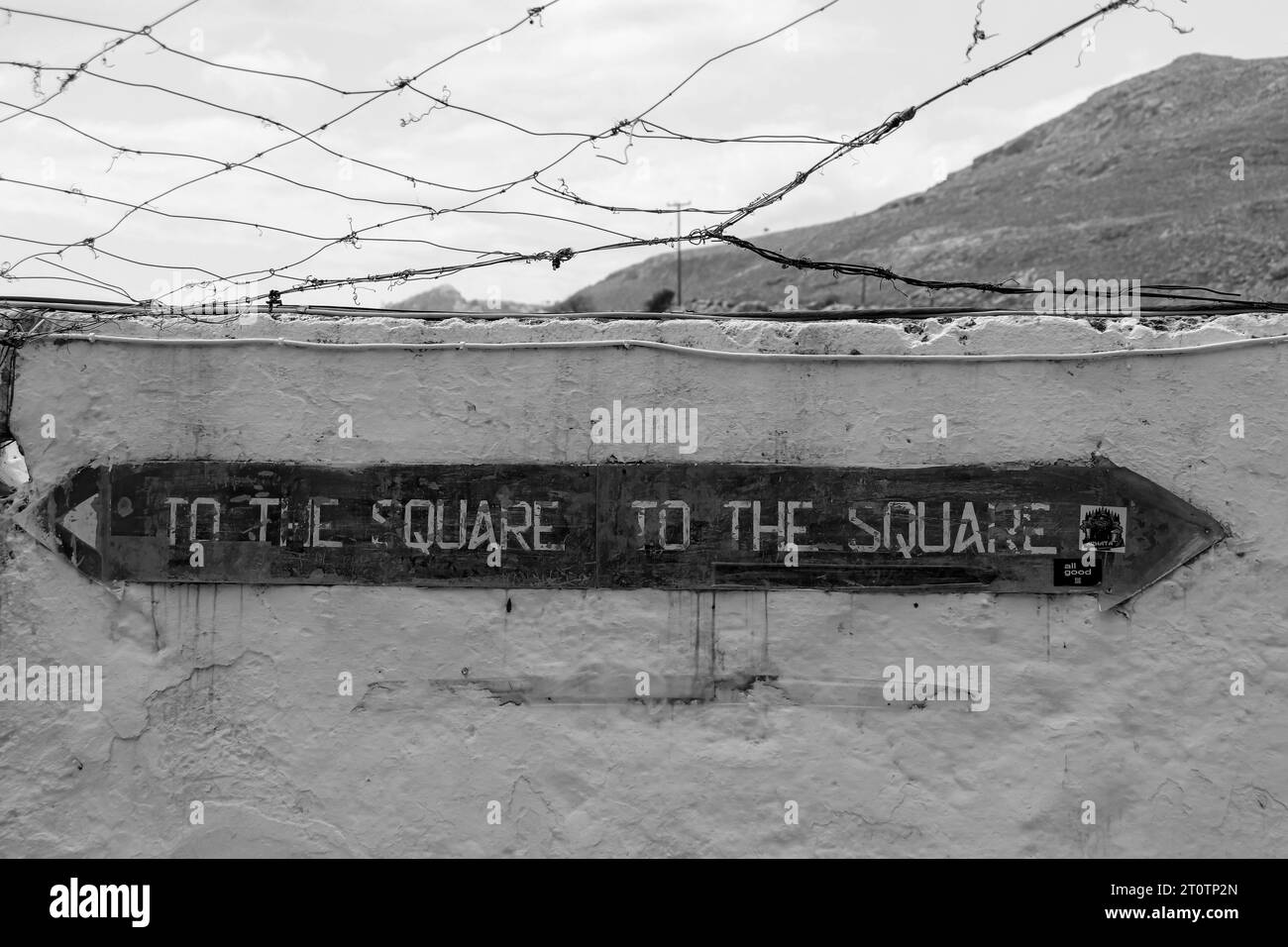 Information direction sign leading tourist to the main square of Lindos ...