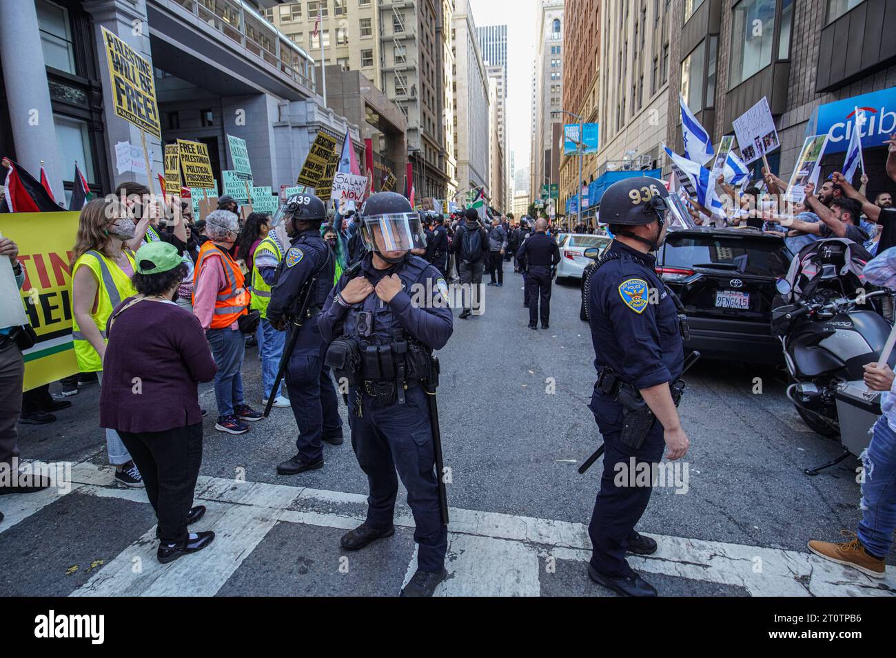 Riot policemen stand between the supporters of Palestine and Israel ...