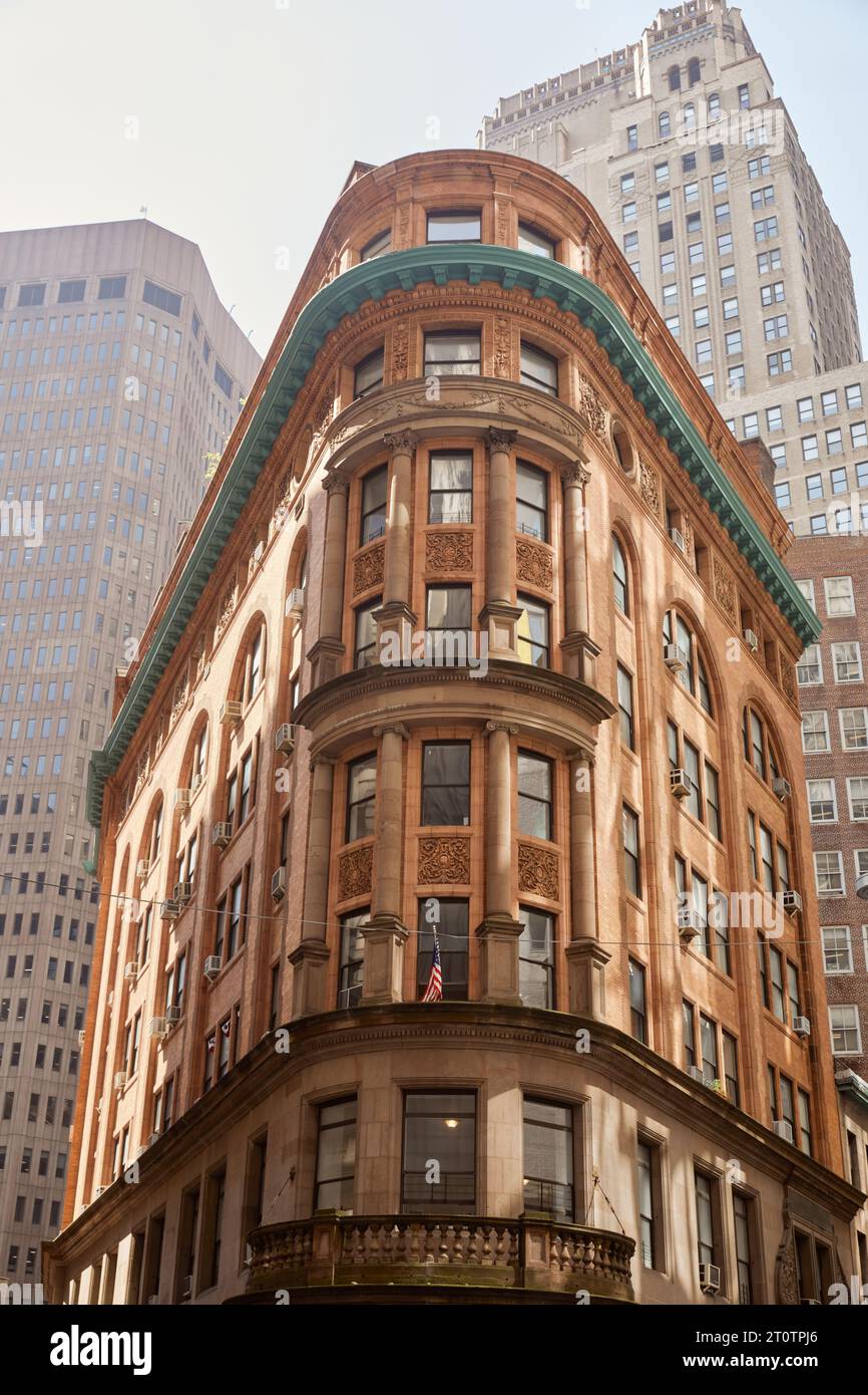 vintage stone building against modern skyscrapers, architectural ...