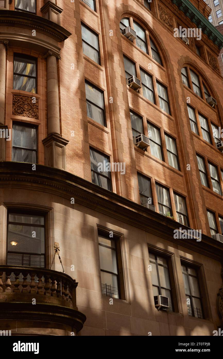 vintage stone building with balustrade on balcony in downtown of new ...