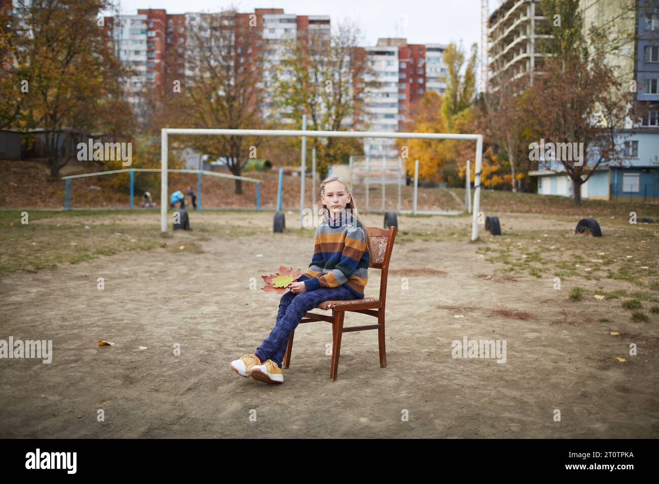 Child looking at ground leaves hi-res stock photography and images - Alamy