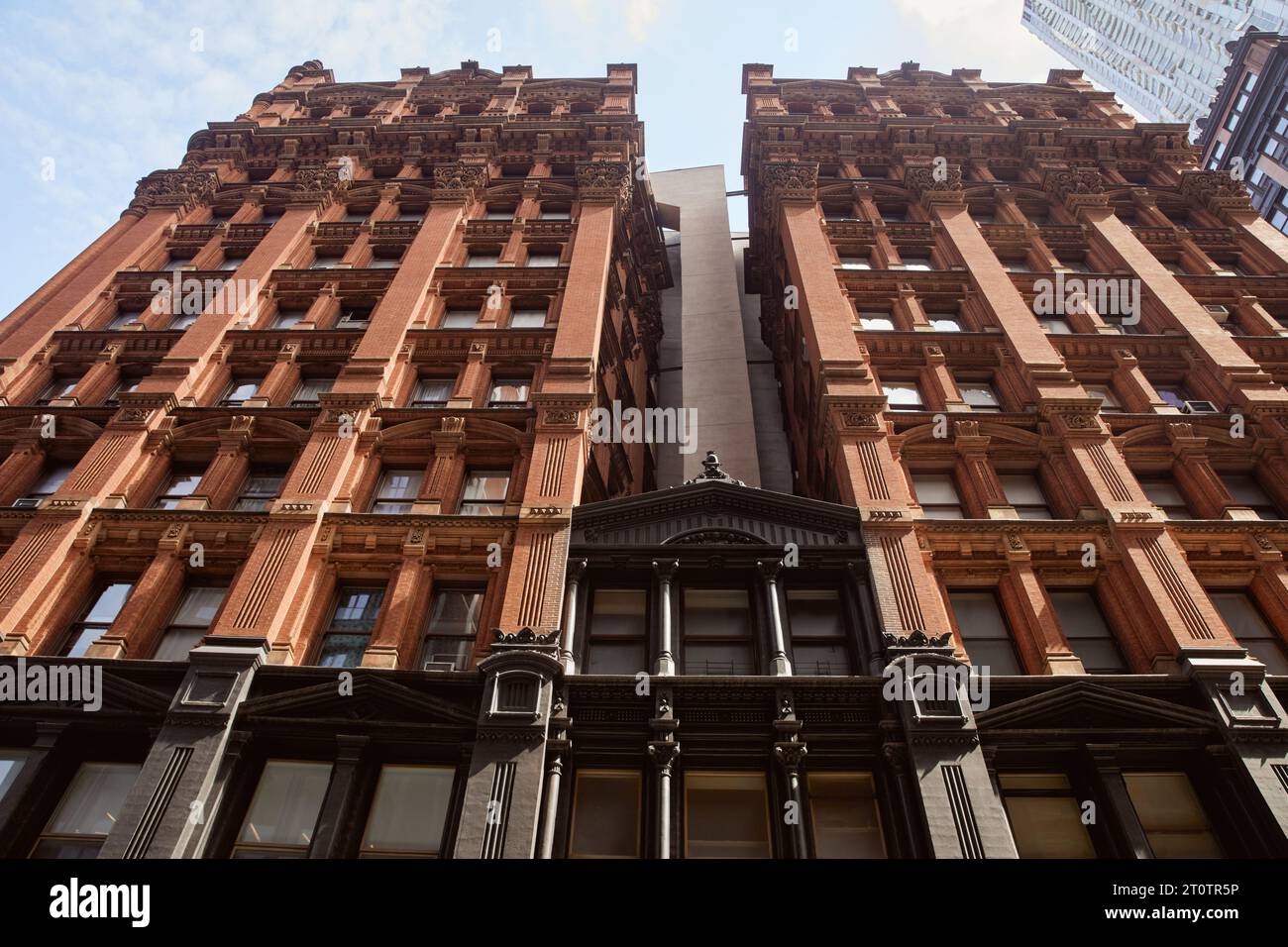 low angle view of vintage stone building in downtown of new york city ...