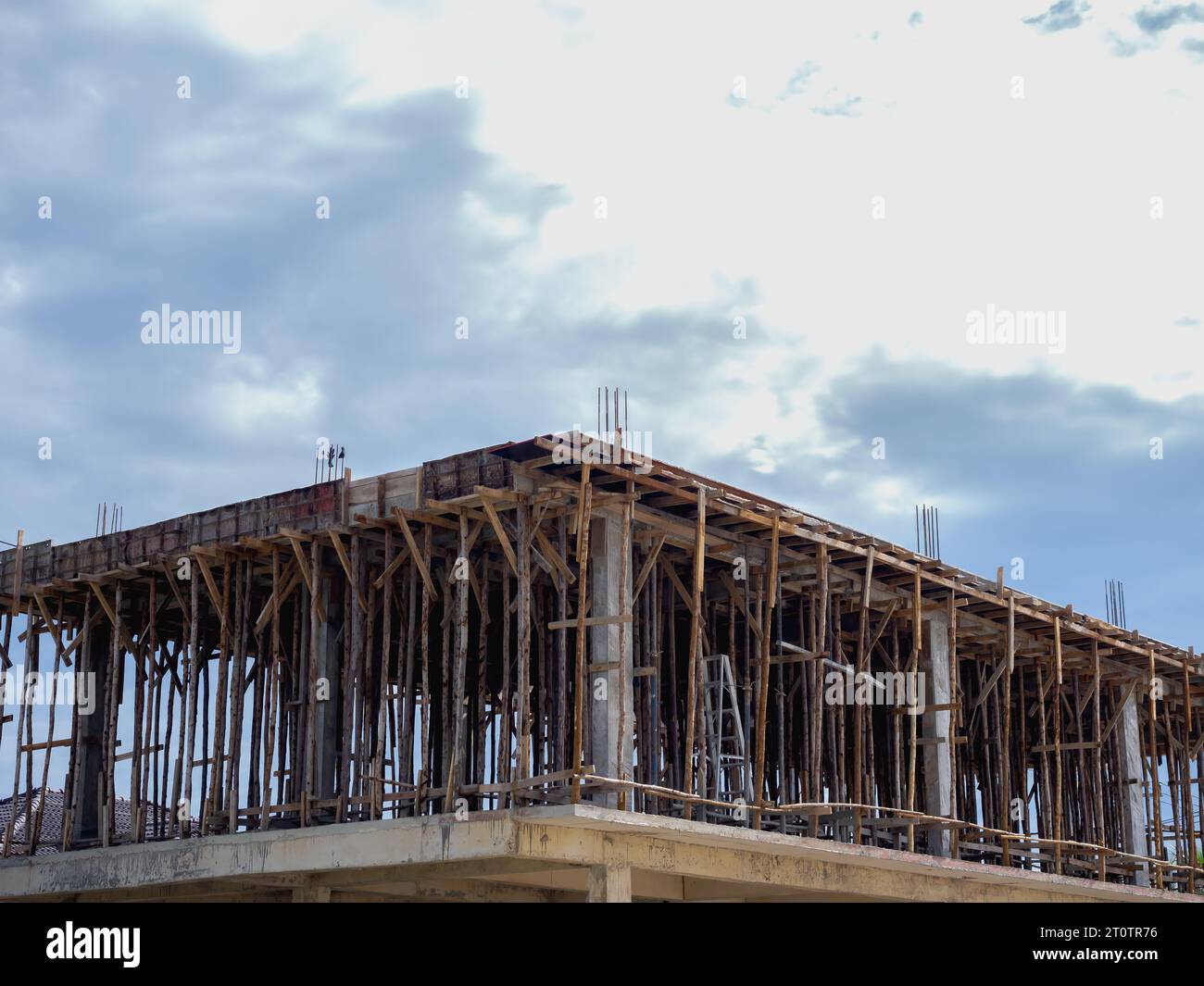 Outdoor scene of home construction building with wood and concrete ...