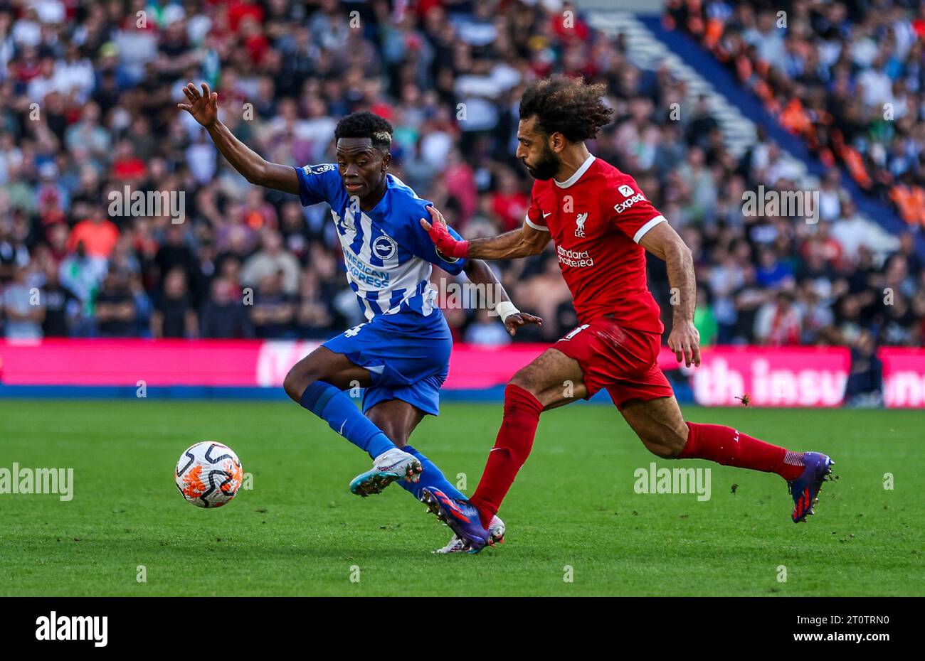 Brighton and Hove Albion's Simon Adingra and Liverpool's Mohamed Salah ...