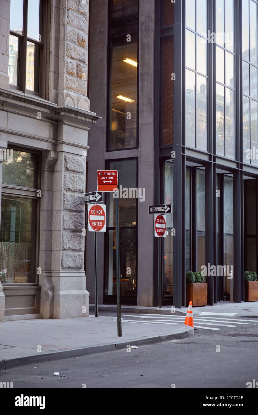 contemporary buildings and different road signs on avenue in new york ...