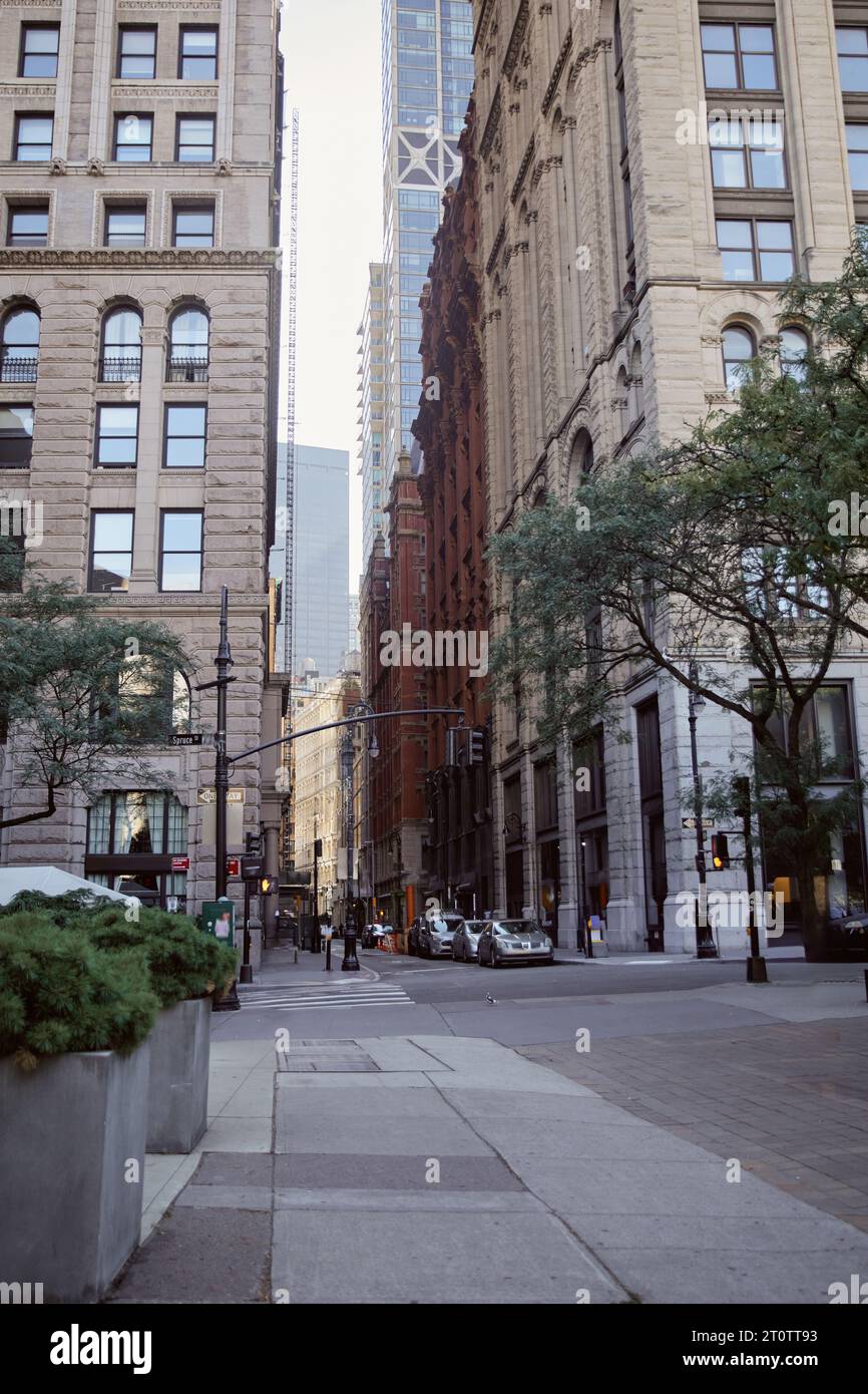 scenic streetscape with stone buildings, cars and autumn trees in new ...